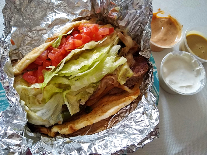 This isn't just a gyro&mdash;it's edible architecture. Layers of meat, fresh veggies, and tzatziki create a handheld masterpiece that defies the laws of physics and napkin capacity.