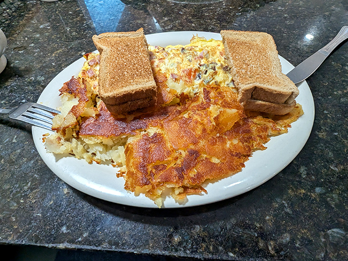 Breakfast alchemy at its finest&mdash;eggs and home fries sharing a plate in perfect harmony, like a morning symphony conducted with a spatula.