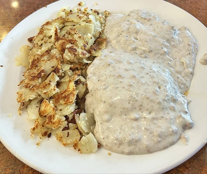 Golden hash browns meet creamy sausage gravy in a breakfast combination that would make your grandmother proud.