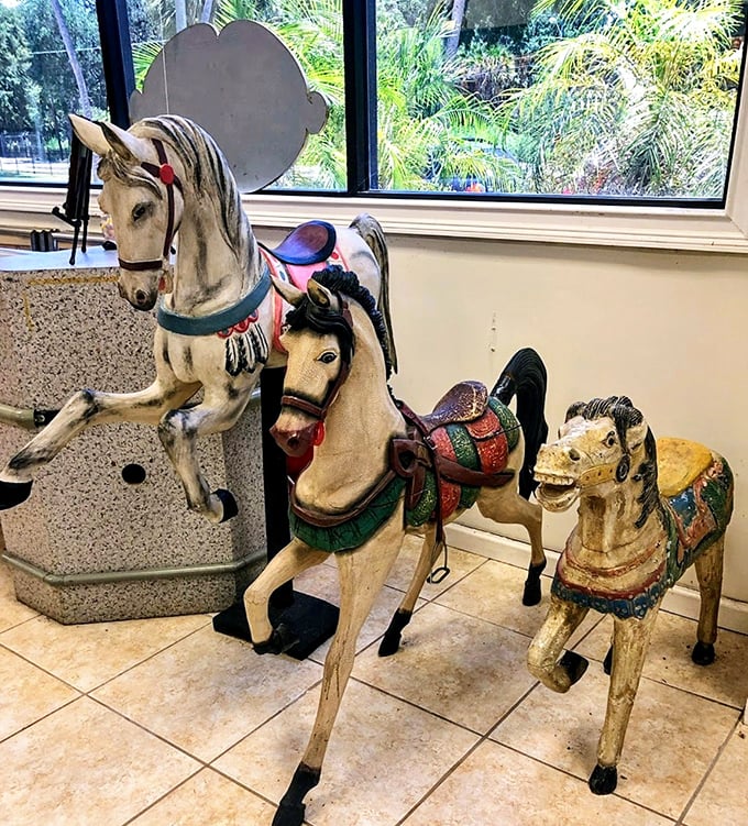 Hand-carved carousel horses stand ready to gallop through decades of childhood dreams and nostalgic summer memories once more.