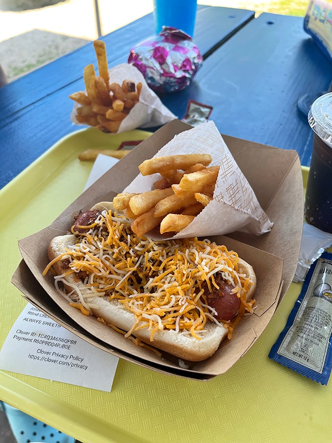 Those legendary fries&mdash;golden, crispy, almost unnaturally perfect&mdash;flanking a cheese-topped hot dog that's not trying to be fancy, just delicious.