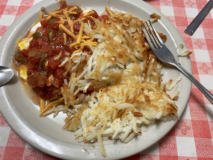 These huevos rancheros don't just arrive on your plate&mdash;they make an entrance, with crispy hash browns standing guard beside eggs smothered in homemade salsa and melted cheese.
