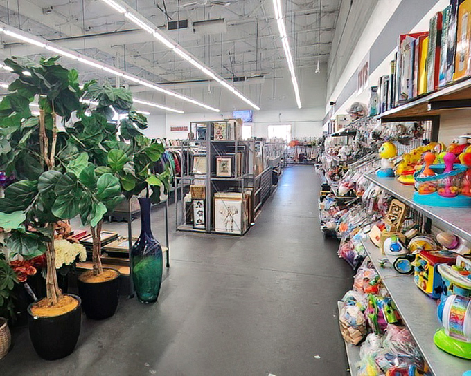 Artificial plants and colorful toys create a retail jungle where one person's decluttered life becomes another's exciting find.