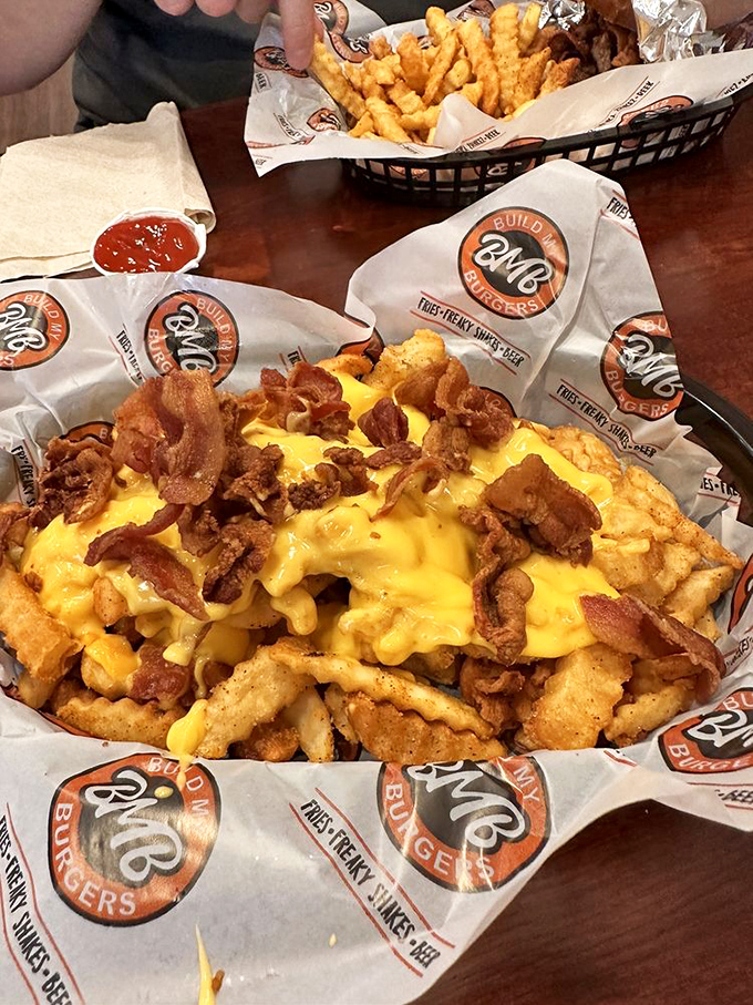 Loaded fries that make sharing a moral dilemma. That cheese pull should have its own Instagram account.