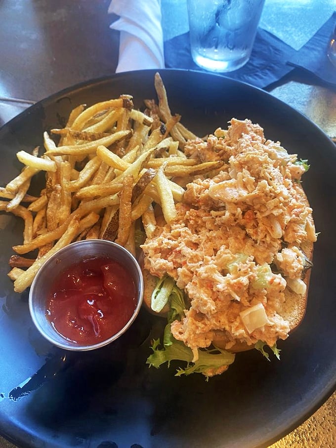 The star of the show: a perfect lobster roll nestled beside golden fries. Sweet chunks of lobster meat in perfect proportion to its buttery vessel.