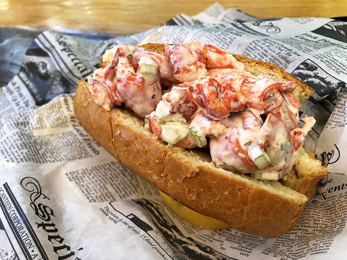 This isn't just a lobster roll; it's a masterclass in simplicity—sweet chunks of lobster meat barely contained by a perfectly toasted bun.