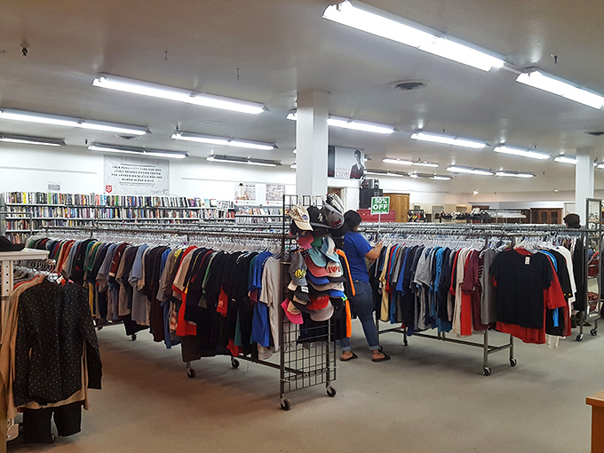 Treasure hunters navigate the men's section with focused determination. That perfect vintage button-down or barely-worn blazer could be hiding just one hanger away.