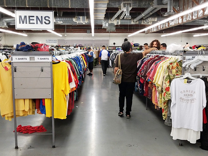 The men's section: where Hawaiian shirts of vacations past and graphic tees with forgotten slogans await their second chance at making a statement.