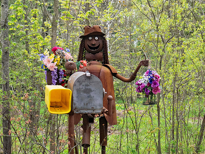 Meet your metallic mail carrier! This rusty rural route runner comes complete with flowers and a friendly face that would brighten anyone's day.