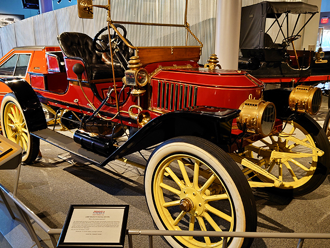 This gleaming vintage automobile with its bright red finish and brass accents isn't just a car&mdash;it's a time capsule with an engine, capturing an era when driving was an adventure.