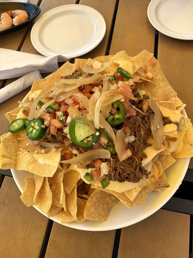 These loaded nachos aren't playing around. When pulled pork, jalapeños, and melty cheese throw a party on tortilla chips, you don't decline the invitation.