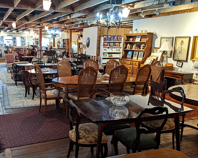 Dining sets from bygone eras wait patiently for their next family gathering, each wooden chair holding decades of conversations in its grain. 