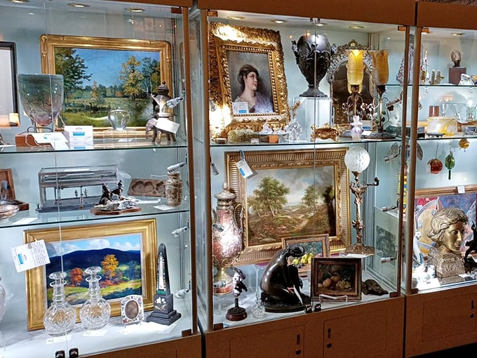 Glass cases protecting precious memories: where paintings, crystal, and collectibles wait patiently for their next chapter to begin.