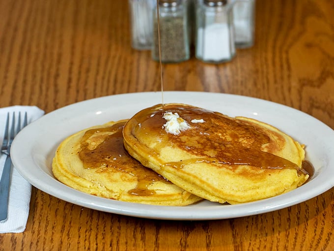Golden-edged pancakes waiting for their maple syrup baptism&mdash;these fluffy discs of joy could convert even the most dedicated egg enthusiast.