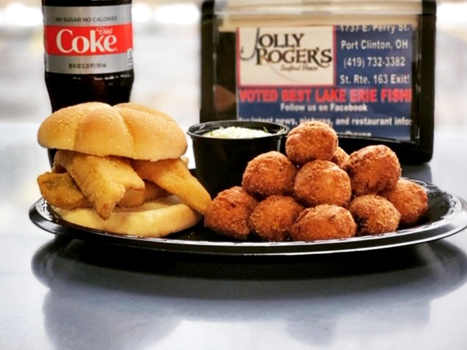 The star of the show: a perch sandwich that would make Neptune himself swim upstream. Golden, crispy perfection nestled in a soft bun with hush puppies standing guard.