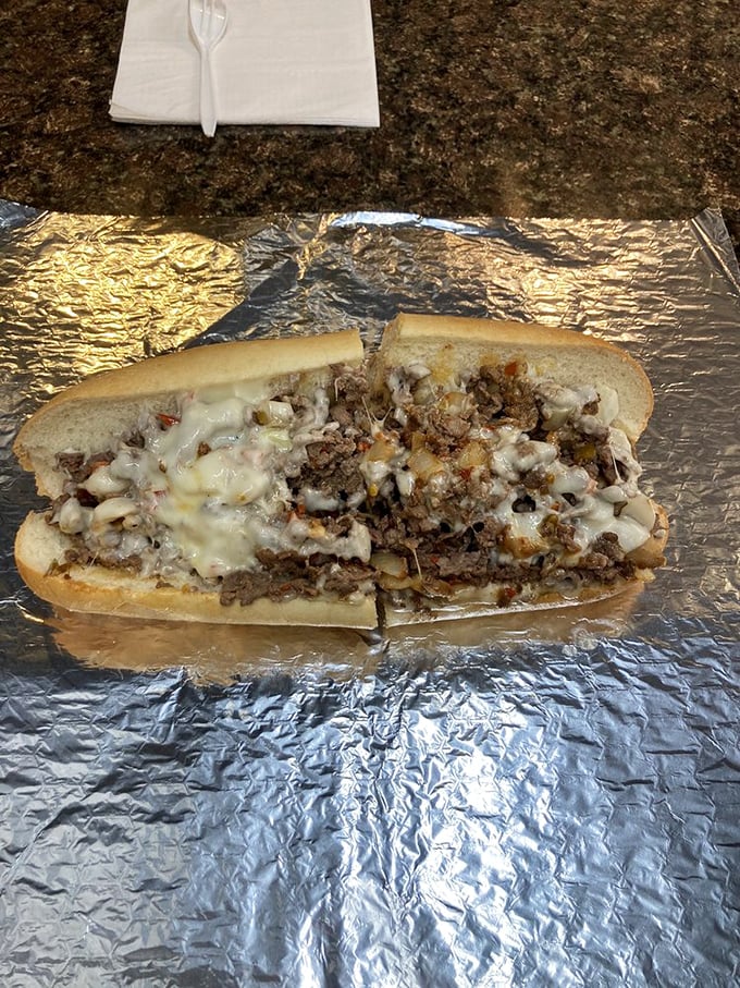 Behold the holy grail of Philadelphia cuisine&mdash;thinly sliced beef and molten cheese embraced by a perfect roll. Poetry in sandwich form.