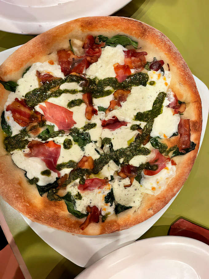 This isn't just pizza&mdash;it's edible art. Fresh mozzarella, pesto, and prosciutto playing together like old friends at a reunion.