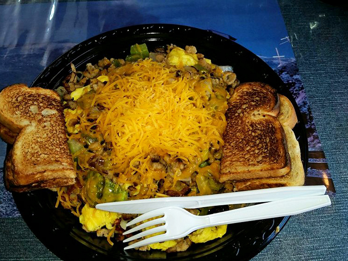 Breakfast platters arrive like edible sunrises, with golden cheese melting into scrambled eggs alongside perfectly toasted bread&mdash;fuel for your own day's journey.