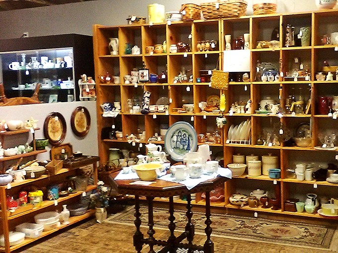 Floor-to-ceiling pottery creates a ceramic wonderland where every piece whispers tales of Sunday dinners and special occasions long past.