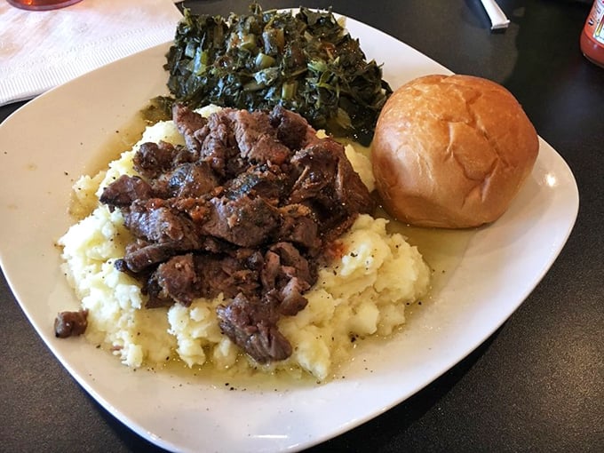Tender pot roast nestled on a cloud of mashed potatoes with collard greens. Southern comfort that speaks directly to your soul.