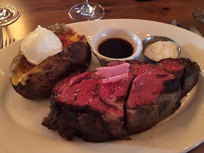 Behold the star of the show: prime rib so perfectly pink it should have its own Instagram account, accompanied by a loaded potato that refuses to be upstaged.