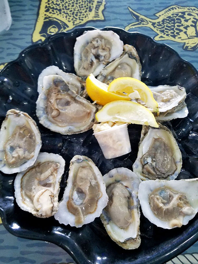 These oysters aren't just served; they're presented &ndash; a briny celebration of the sea with bright lemon wedges standing by for duty.