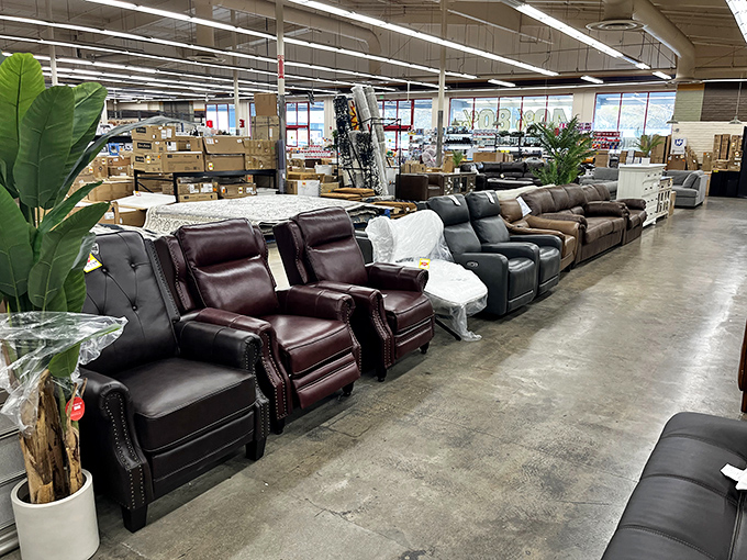 Leather recliners lined up like luxury cars at a discount dealership - your backside will never know you saved hundreds.