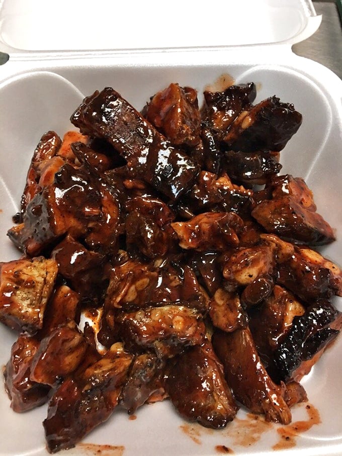 These rib tips aren't just glazed, they're practically lacquered with decades of BBQ wisdom. Each bite is a smoky, sticky journey to happiness.