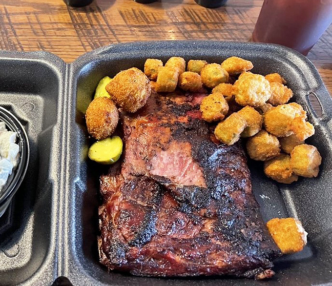 Ribs sporting that gorgeous smoke ring nestled alongside golden-fried hush puppies &ndash; a partnership more harmonious than Simon and Garfunkel.