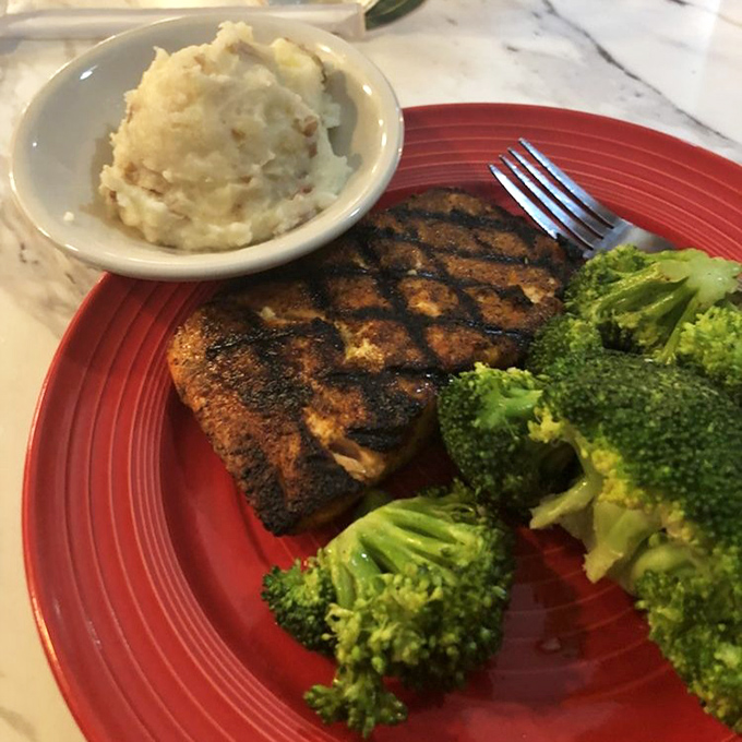 This blackened salmon isn't just cooked&mdash;it's performed. Perfectly charred exterior, flaky interior, and sides that don't know they're supposed to be supporting actors.