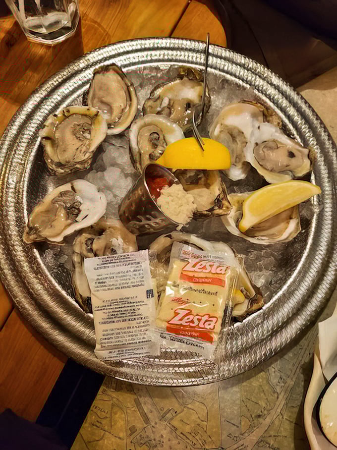 Fresh oysters on ice with lemon wedges and cocktail sauce&mdash;nature's perfect appetizer and the ocean's version of "here's a little something to tide you over."