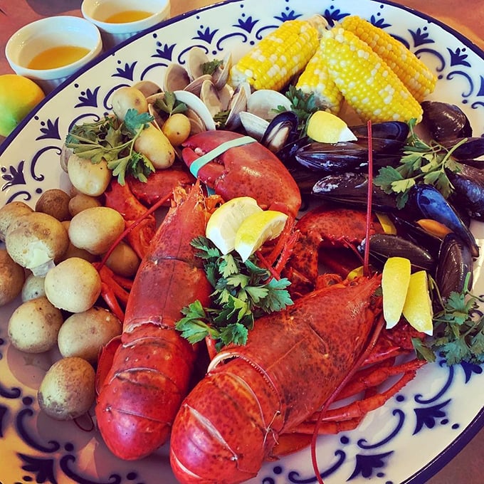 A seafood extravaganza that would make Neptune himself weep with joy &ndash; whole lobster surrounded by its delicious ocean friends and sweet corn.