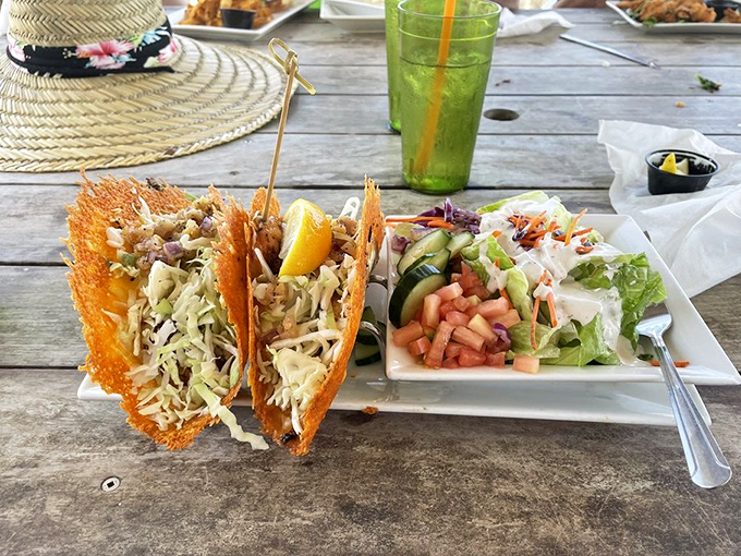 These aren't your average tacos&mdash;crispy cheese fans cradle fresh grouper while a side salad pretends you're making healthy choices.