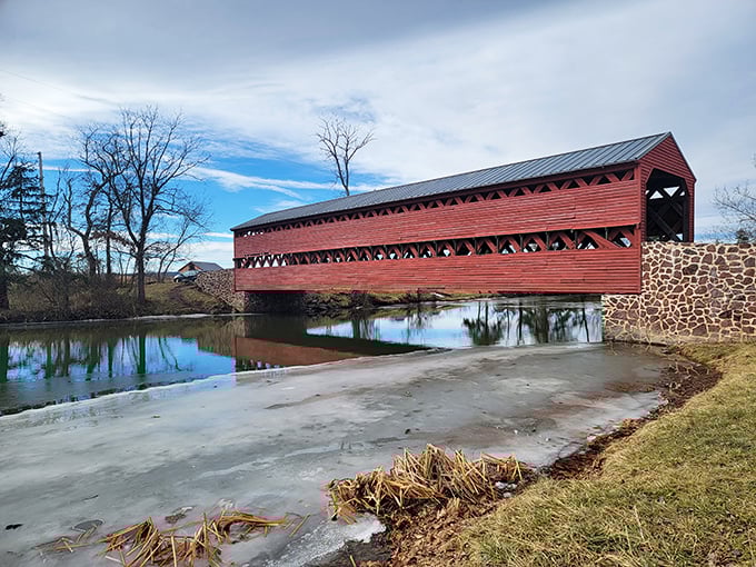 The bridge's classic silhouette creates a postcard-worthy scene against blue Pennsylvania skies. That rusty red color isn't just pretty&mdash;it's historically accurate craftsmanship.