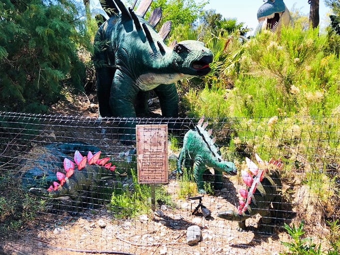 Behind the scenes, smaller dinosaur sculptures create their own Jurassic neighborhood of discovery and delight.