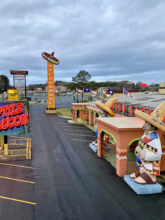 Reptile Lagoon and colorful statues create a fever-dream landscape that makes you wonder if your gas station coffee was stronger than advertised.