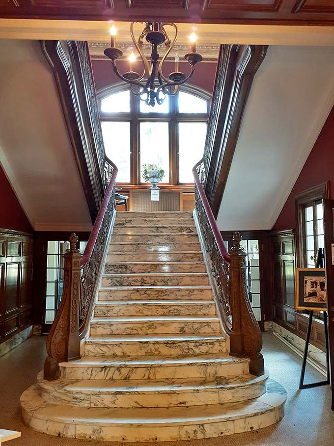 Marble steps worthy of a Cinderella moment lead upward beneath a wooden arch that whispers, "Yes, you're definitely in a castle now."