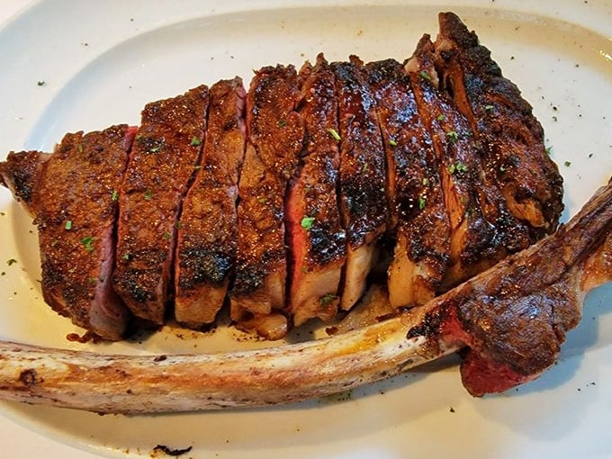 This isn't just a steak—it's a carnivorous masterpiece with a crust that should have its own Instagram account. The bone? Nature's handle.