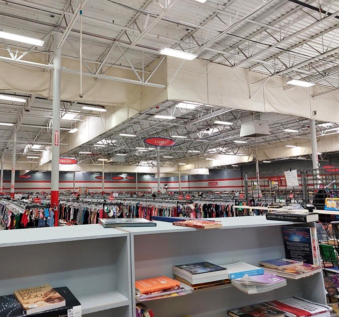 The clothing section stretches toward infinity, a textile galaxy where vintage polyester and last season's designer labels orbit each other in perfect harmony.