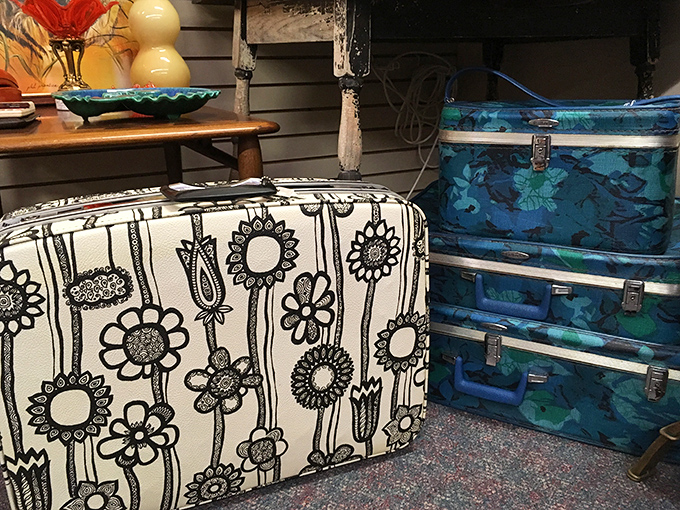 Luggage with personality! That flower-power suitcase is begging to be rescued and given a second life as a quirky side table.