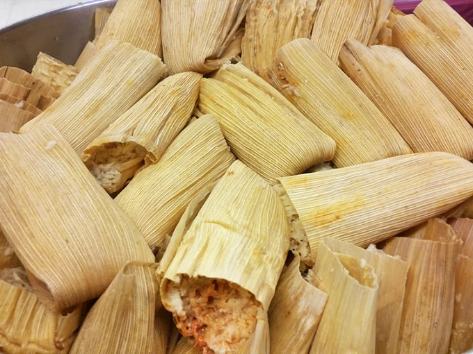 Corn husks bundled like precious gifts, each one hiding a treasure of masa and filling. These aren't just tamales; they're edible time capsules of generations-old recipes.