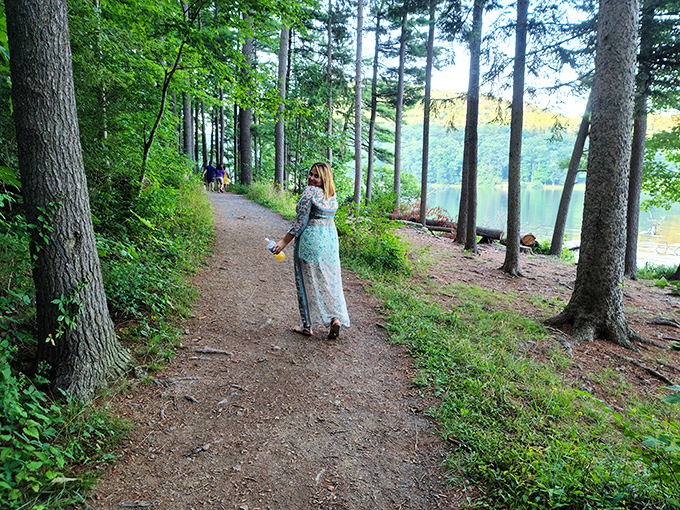 Wandering the lakeside trails feels like stepping into a storybook forest. The dappled sunlight creates nature's own spotlight on your adventure.
