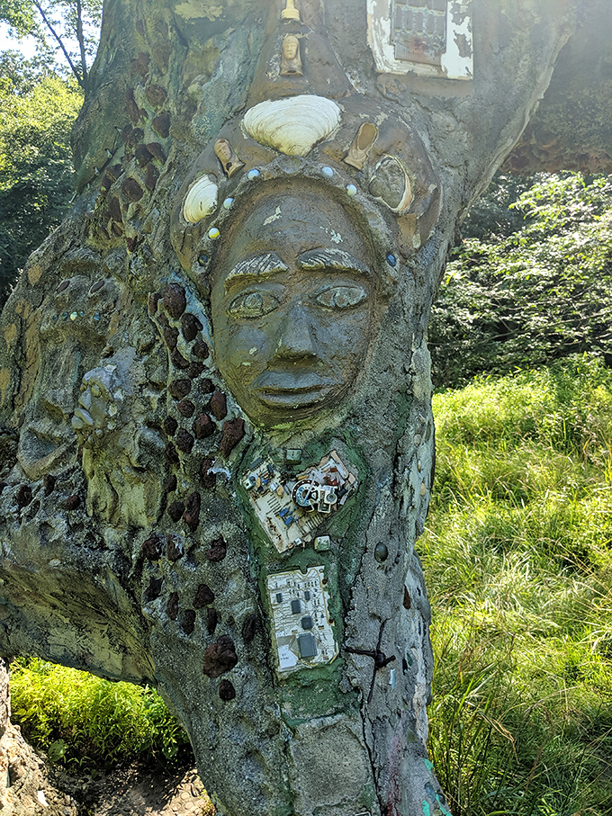 Ancient wisdom meets modern art in this striking sculptural face. The artist's hand transformed concrete and stone into an expression that's both tribal and timeless.