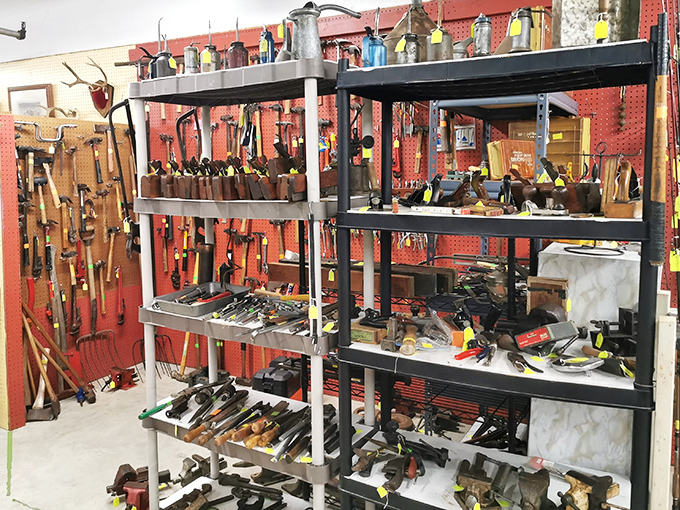 Tool collectors, rejoice! This magnificent wall of vintage implements would make Tim Allen grunt with approval. Each worn handle tells a story of craftsmanship.