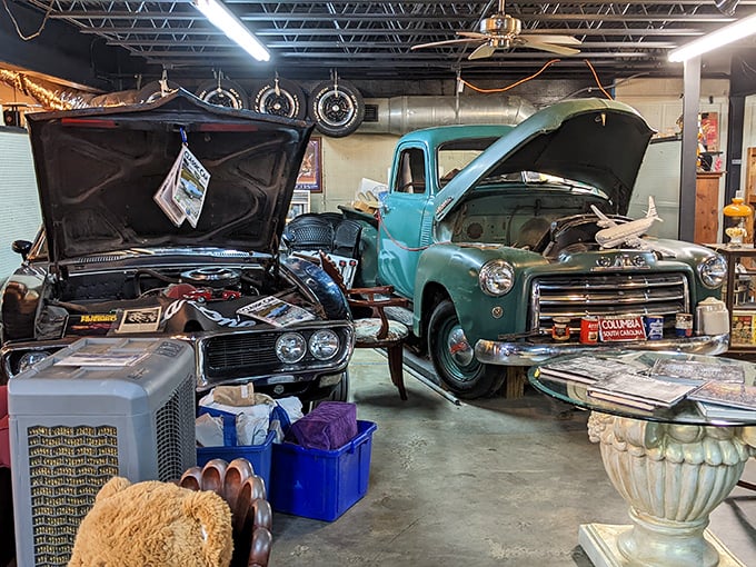 Classic cars with their hoods up&mdash;automotive surgery on display. That turquoise pickup looks ready for a Sunday drive to the malt shop.