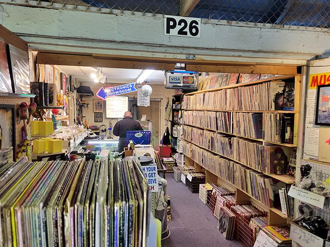 Vinyl heaven awaits in booth P26, where album covers serve as time machines to decades when music came with artwork you could actually hold.