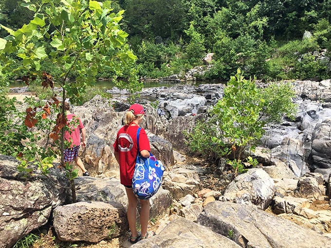 Explorers navigate the rocky terrain, backpacks filled with adventure essentials. The modern-day Lewis and Clark experience, just with better footwear.