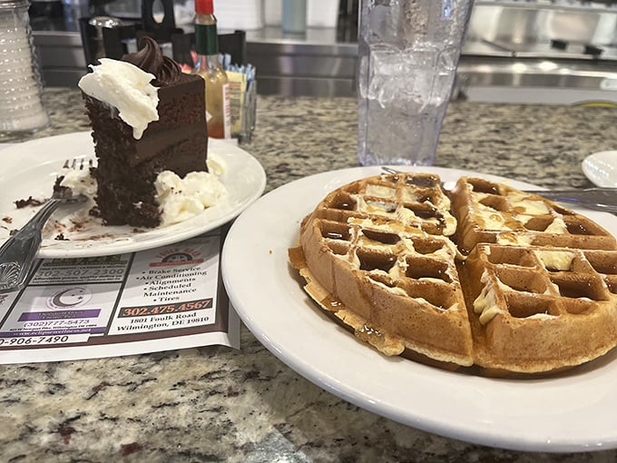 Golden waffles and decadent chocolate cake sharing a counter&mdash;breakfast and dessert having a friendly debate about which should come first.