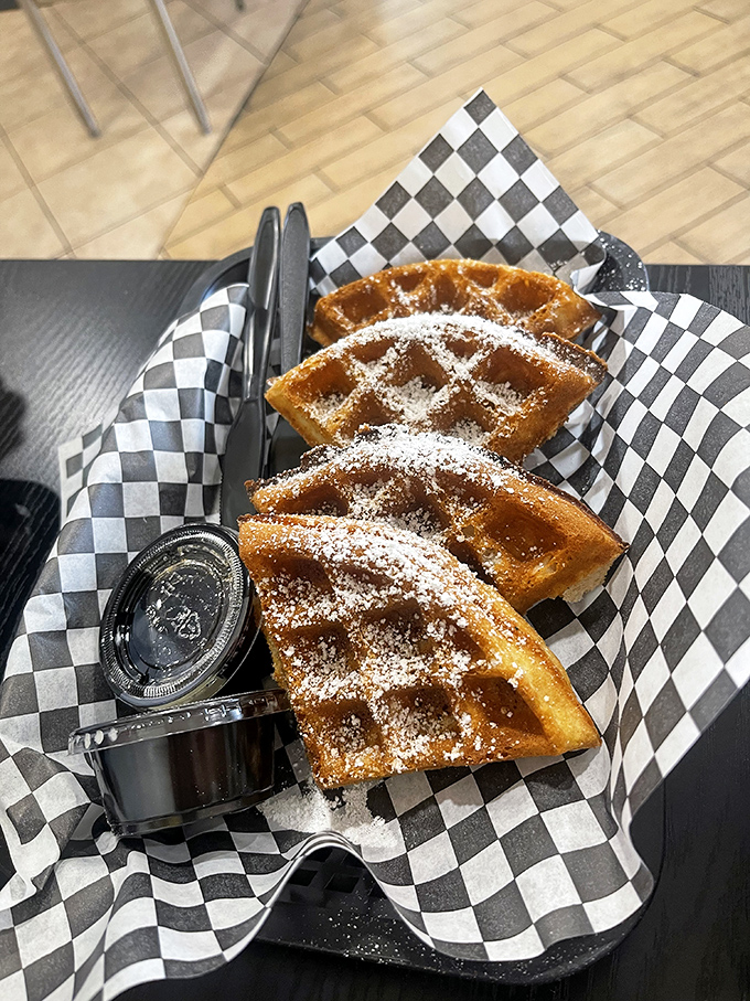 Golden waffles dusted with powdered sugar&mdash;the unexpected sweet counterpoint to Nashville heat that makes you wonder why this combo isn't everywhere.