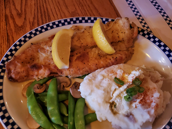 The star of the show: pan-fried walleye with a golden crust that shatters like thin ice on a spring lake.